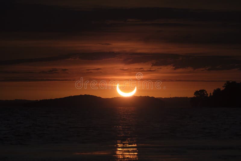 Solar Eclipse at Sunrise Over Lake Stock Photo - Image of nature ...