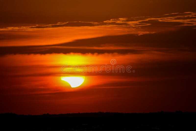 Solar eclipse at sunset stock photo. Image of nature - 117591818