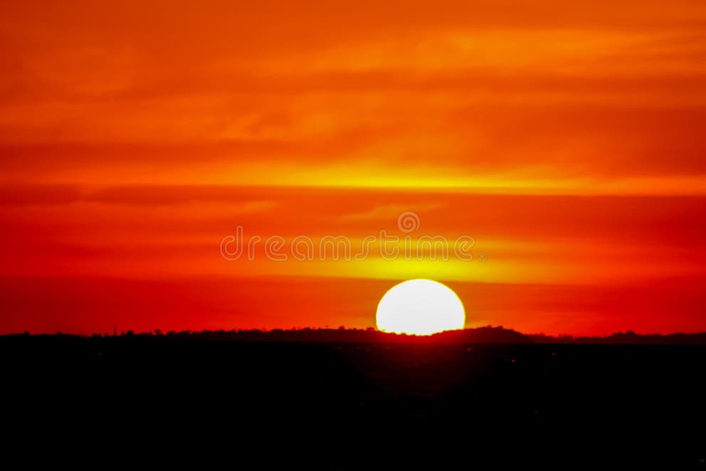 Solar eclipse at sunset stock photo. Image of radiant - 117591826
