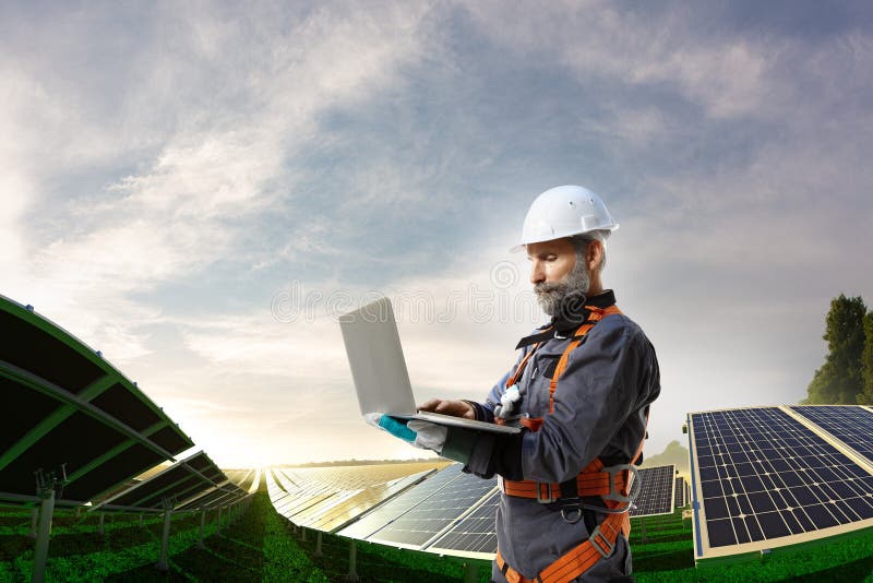 Solar Energy Engineer Using Laptop for Check Station Stock Photo ...