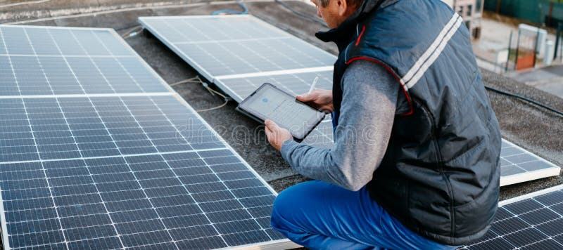 Solar Energy Engineer Using Tablet for Check Power Station. Alternative ...
