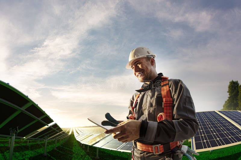 Solar Energy Engineer Using Tablet for Check Power Station Smiling ...