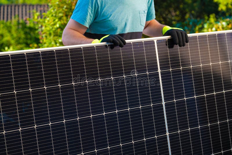 Solar Energy.Green Energy. Solar Panel in the Hands of a Worker ...