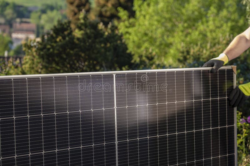 Solar Energy. Solar Panel in the Hands of a Worker .Installation of ...