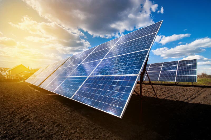 Solar Energy System on Plowed Field and Sunlight at Sky with Beautiful ...