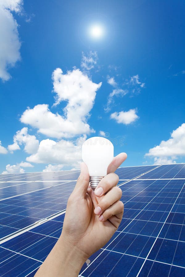 Solar Energy Panels and Light Bulb in Hand, Energy Stock Image - Image ...