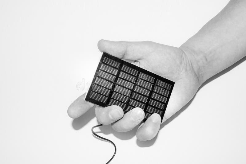 Photovoltaic panel in hand stock image. Image of hand - 111009711
