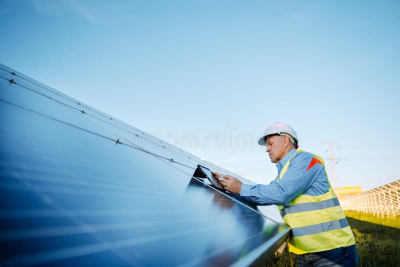 Solar Engineer Working with Digital Tablet at Renewable Energy Farm ...
