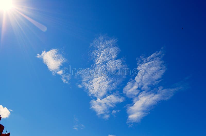 Solar Glare and Rays in the Blue Sky. Stock Image - Image of clouds ...