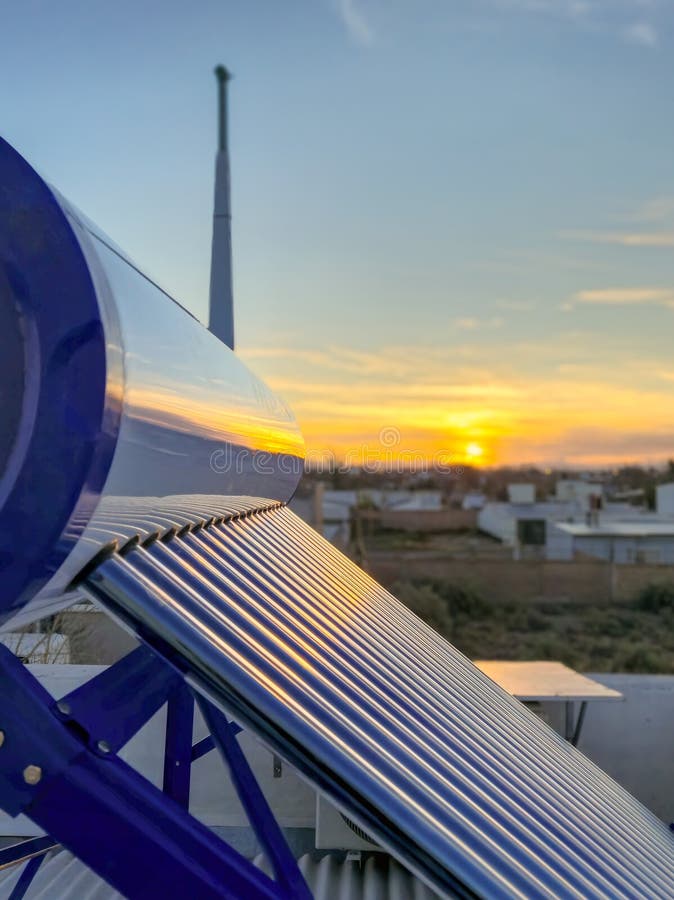 Solar Hot Water Tank at Sunset. Vertical Photo Stock Photo - Image of ...