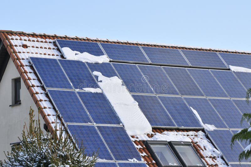 Roof With Solar Panels Covered In Snow Stock Photo - Image of lines ...