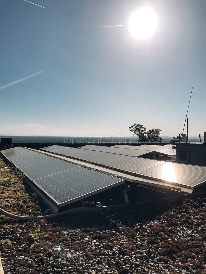 A Solar Panel Array is Installed on a Roof Stock Photo - Image of ...