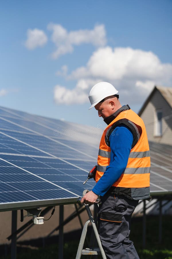 Solar Panel Assembler Stands on a Ladder. Stock Image - Image of ...
