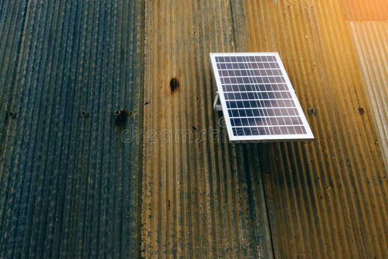 Solar Panel Attached on Old Zinc Wall. Electric Solar Panel on the ...