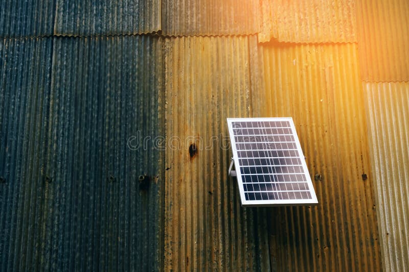 Solar Panel Attached on Old Zinc Wall. Electric Solar Panel on the ...