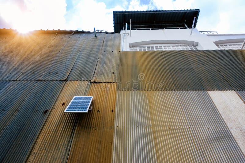 Solar Panel Attached on Old Zinc Wall. Electric Solar Panel on the ...