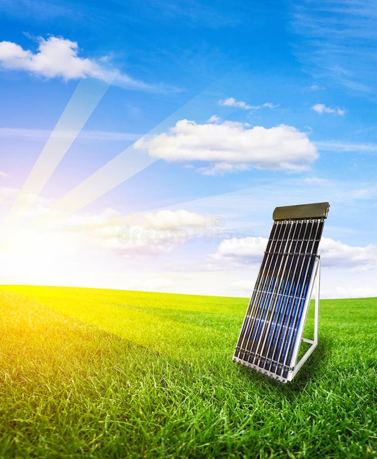 Solar Panel Battery on the Field with Green Grass Blue Sky and Rays of ...
