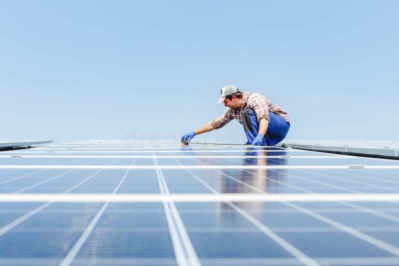 Solar Panel Energy. Electrical Engineer Man is Working in Solar Station ...