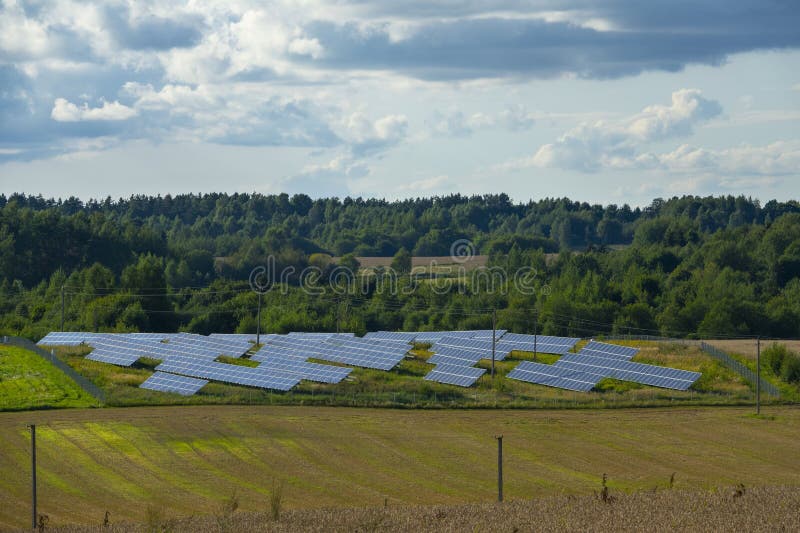 Solar Panel Farm in the Middle of the Fields Stock Photo - Image of ...