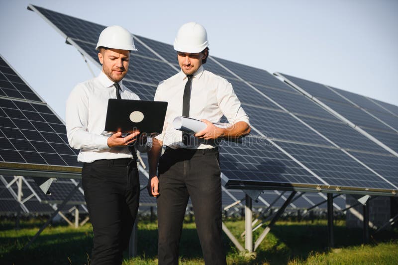 Solar Panel Farm. Two European Engineers Inspect Solar Panels Stock ...