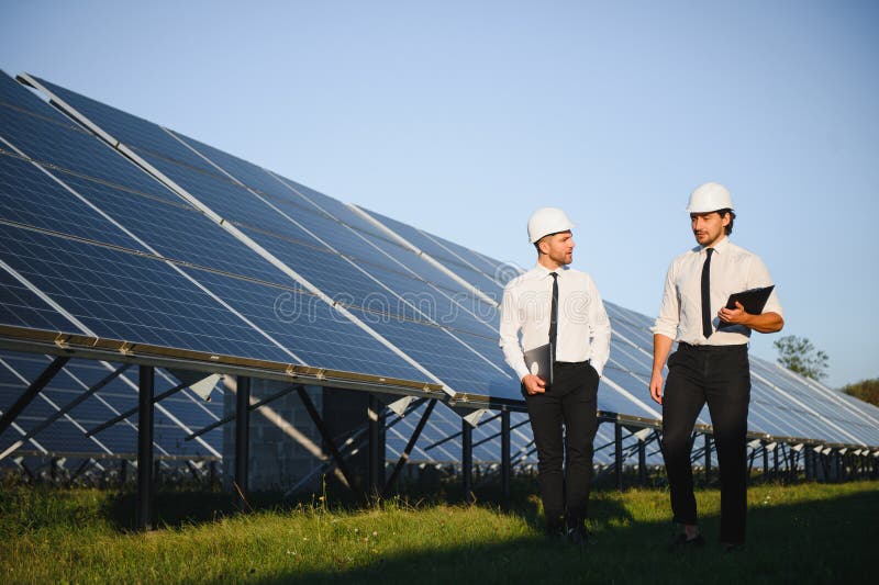 Solar Panel Farm. Two European Engineers Inspect Solar Panels Stock ...