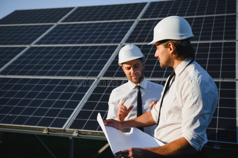 Solar Panel Farm. Two European Engineers Inspect Solar Panels Stock ...