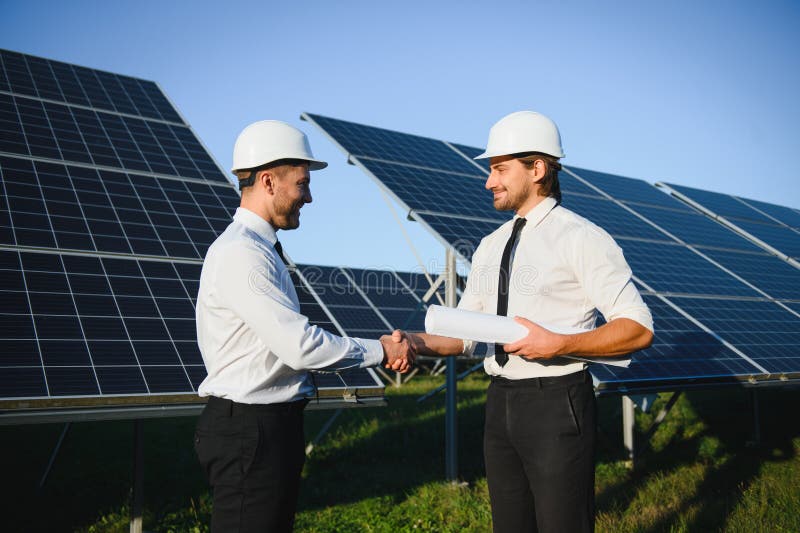 Solar Panel Farm. Two European Engineers Inspect Solar Panels Stock ...