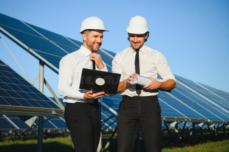 Solar Panel Farm. Two European Engineers Inspect Solar Panels Stock ...