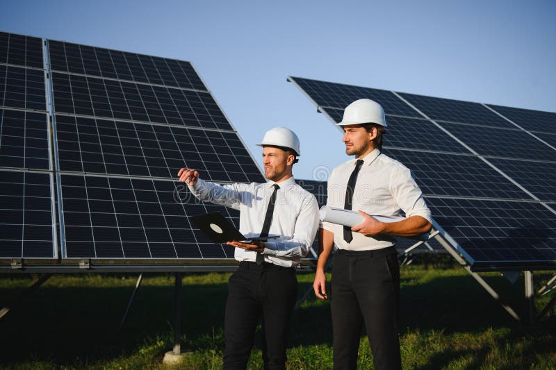 Solar Panel Farm. Two European Engineers Inspect Solar Panels Stock ...