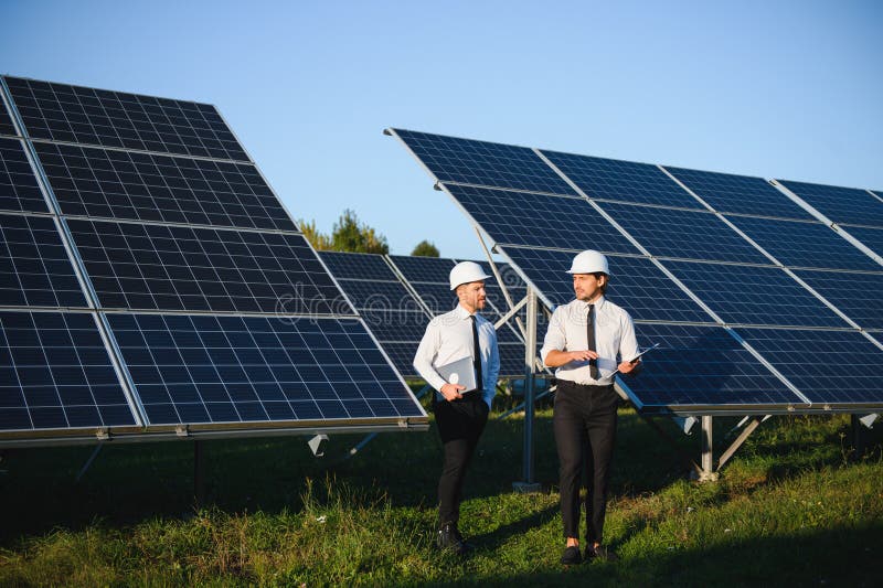 Solar Panel Farm. Two European Engineers Inspect Solar Panels Stock ...