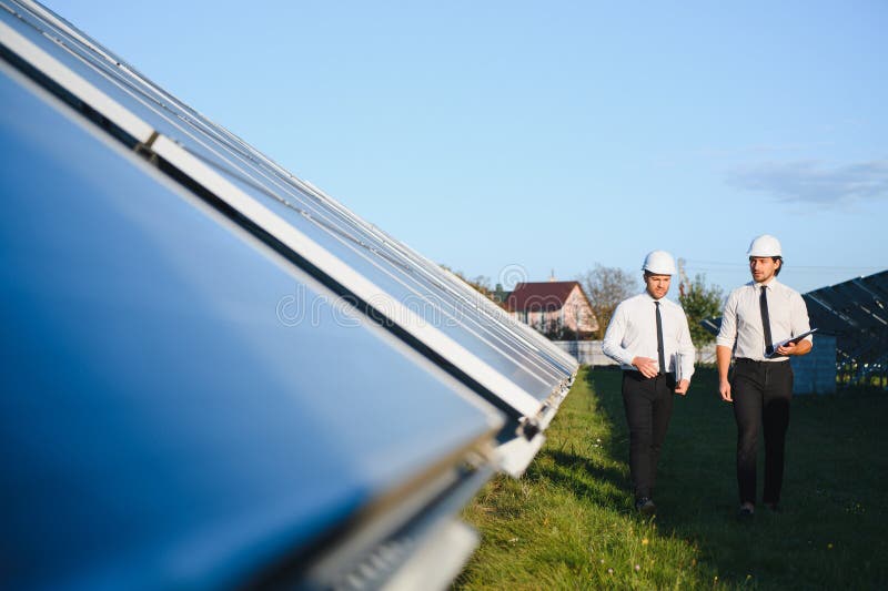 Solar Panel Farm. Two European Engineers Inspect Solar Panels Stock ...