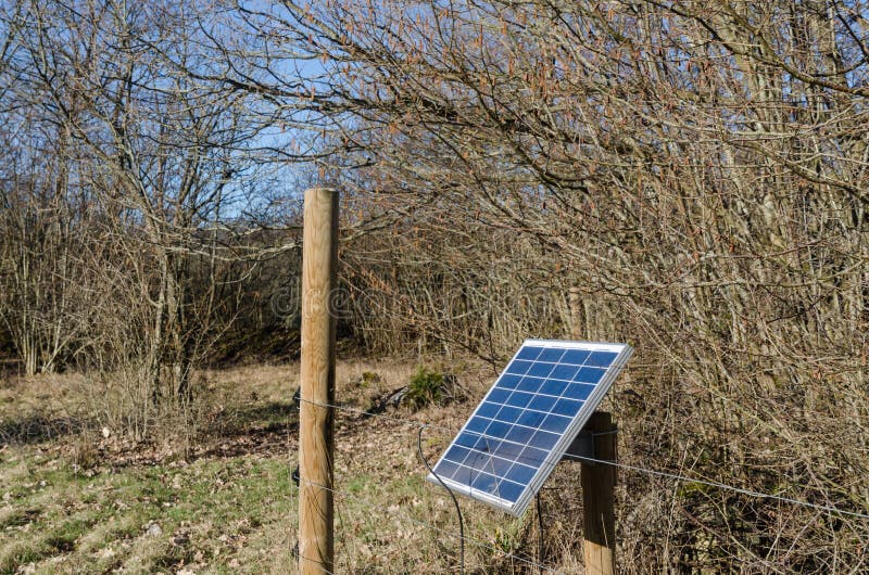 Solar panel by a fence stock image. Image of environment - 143798325