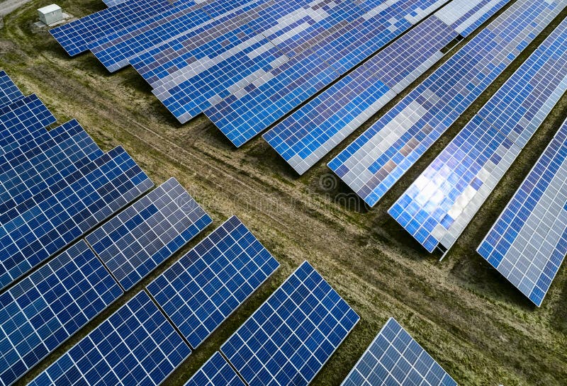 Solar Panel Field at Work with Sun Reflection Stock Photo - Image of ...