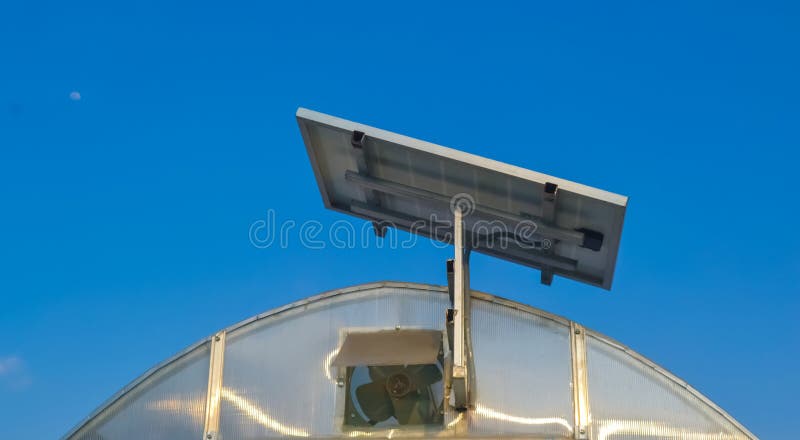 Solar Panel Hut with Blue Sky and Moon in the Background Stock Photo ...