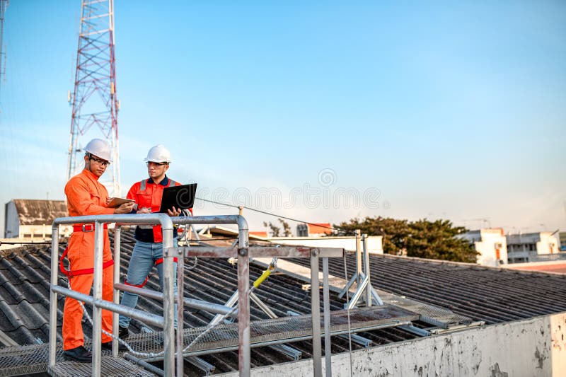 A Solar Panel Maintenance and Installer is Checking the Operation of an ...