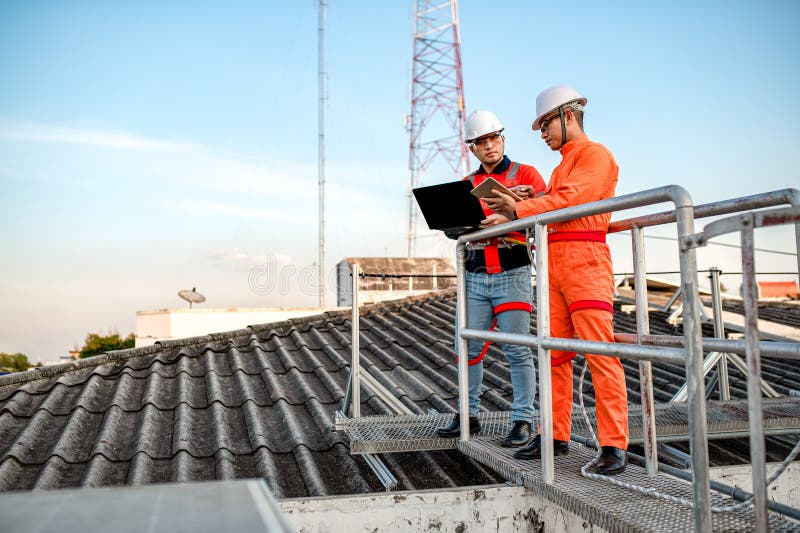 A Solar Panel Maintenance and Installer is Checking the Operation of an ...