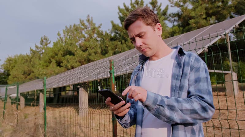 Solar Panel Maintenance Technician Inspecting the Integrity of Panels ...