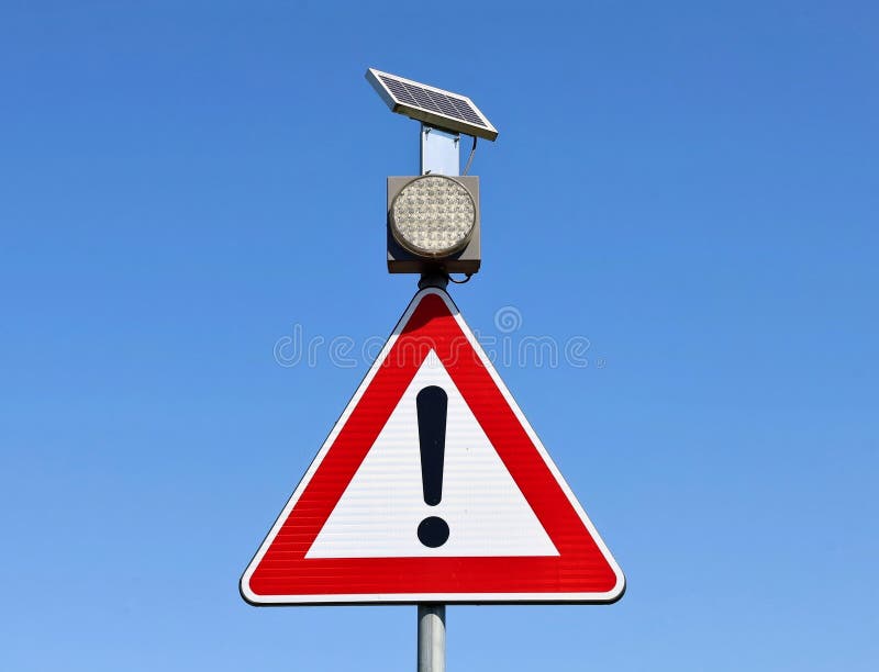 Solar Panel Powered Traffic Warning Light Above a Triangle Warning Sign ...