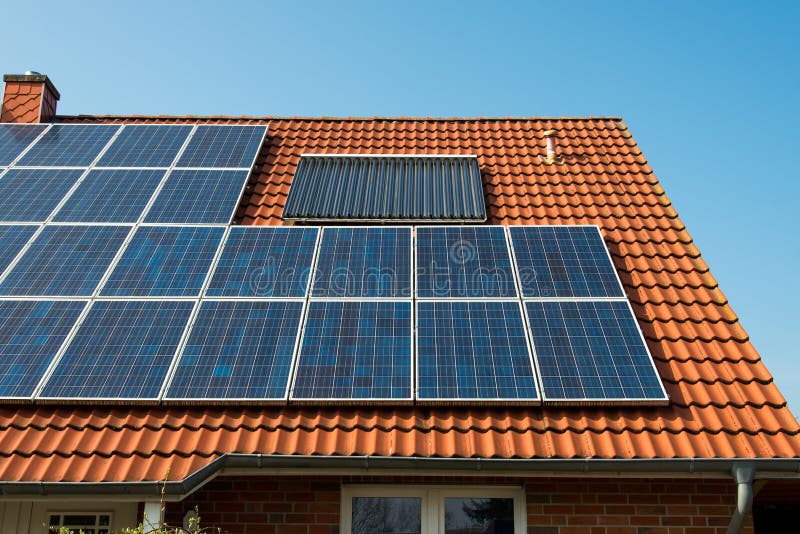 Solar panel on a red roof stock photo. Image of cell - 79549542