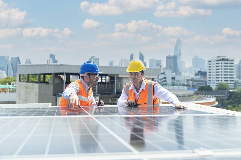 Solar Panel Technician on Roof. Engineer Planning New Ecology Project ...
