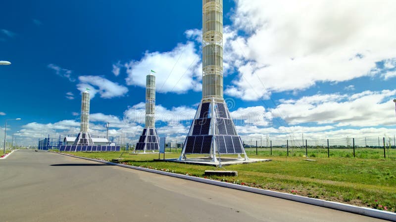 Solar Panel Towers on Solar Plant with High Voltage Tower in Background ...