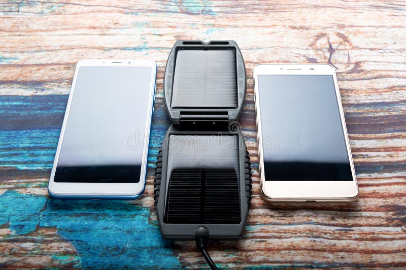 Solar Panel and Two Smartphones. Charge Smartphones with a Solar Panel ...