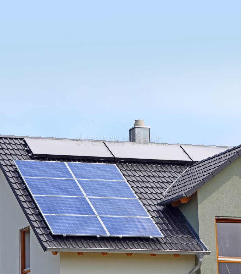 Green Energy Saving Solar Panels on Building Roof Stock Photo - Image ...