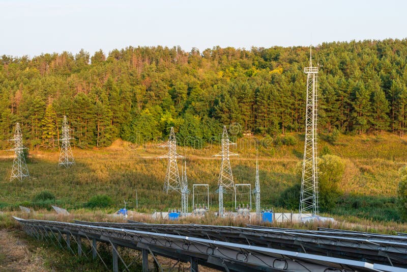 Solar Panels on a Background of Power Lines among the Forest Stock ...