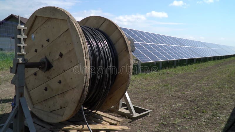 Solar Panels in the Background of a Roll of Cable, Construction of ...