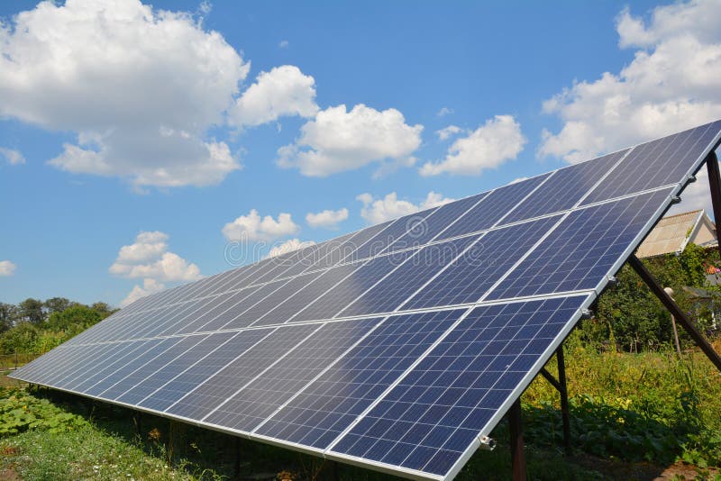 Solar Panels with Beautiful Clouds Sky in the Garden. Backyard Solar ...