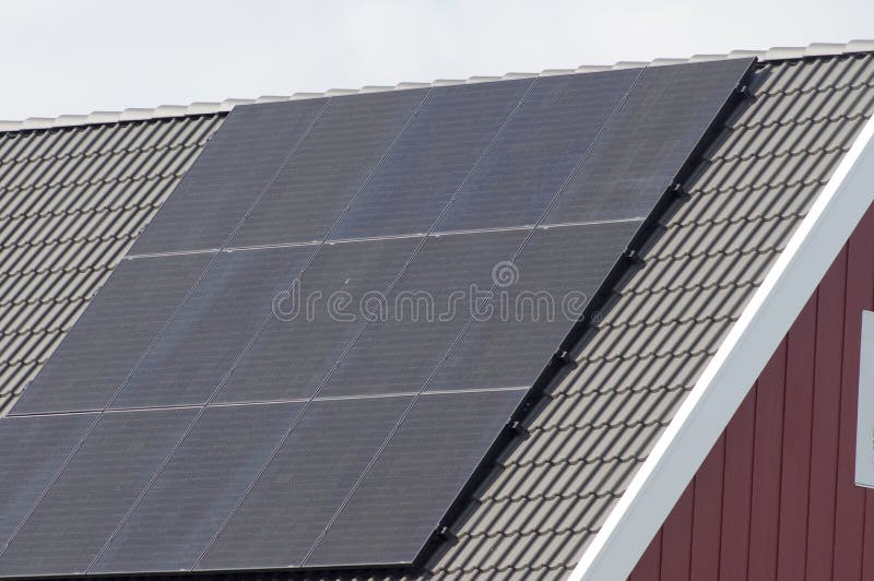 Solar Panels on a Brown Roof Stock Image - Image of sunlight, facade ...
