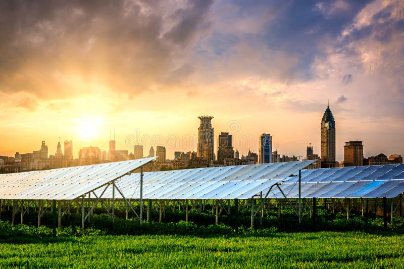 Solar Panels and City Skyline Stock Photo - Image of technology ...