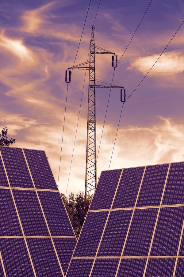 Solar Panels with Electricity Pylon in the Sunset Stock Photo - Image ...