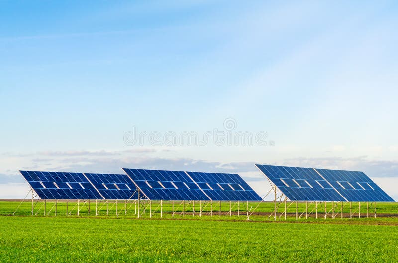 Solar Panels in a Field on Green Grass. Environmentally Friendly Stock ...